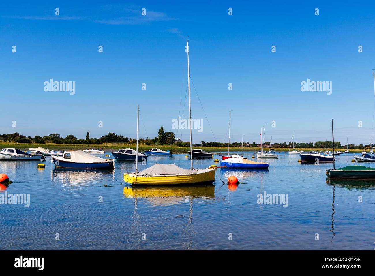 Small boats moored at Bosham Quay, Bosham, a coastal village on the ...