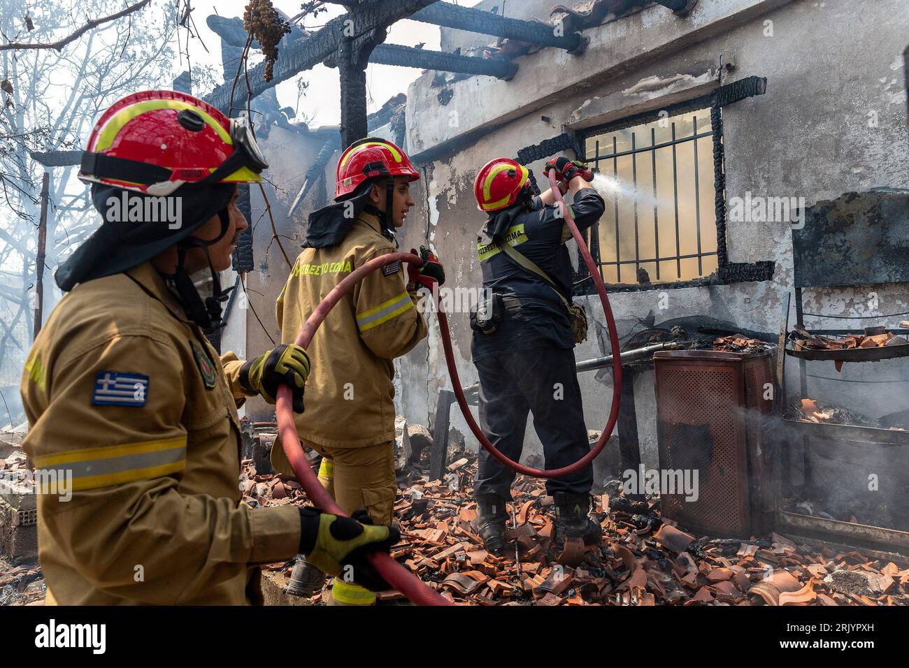 Athens, Greece. 23rd Aug, 2023. Firefighters try to control a wildfire ...