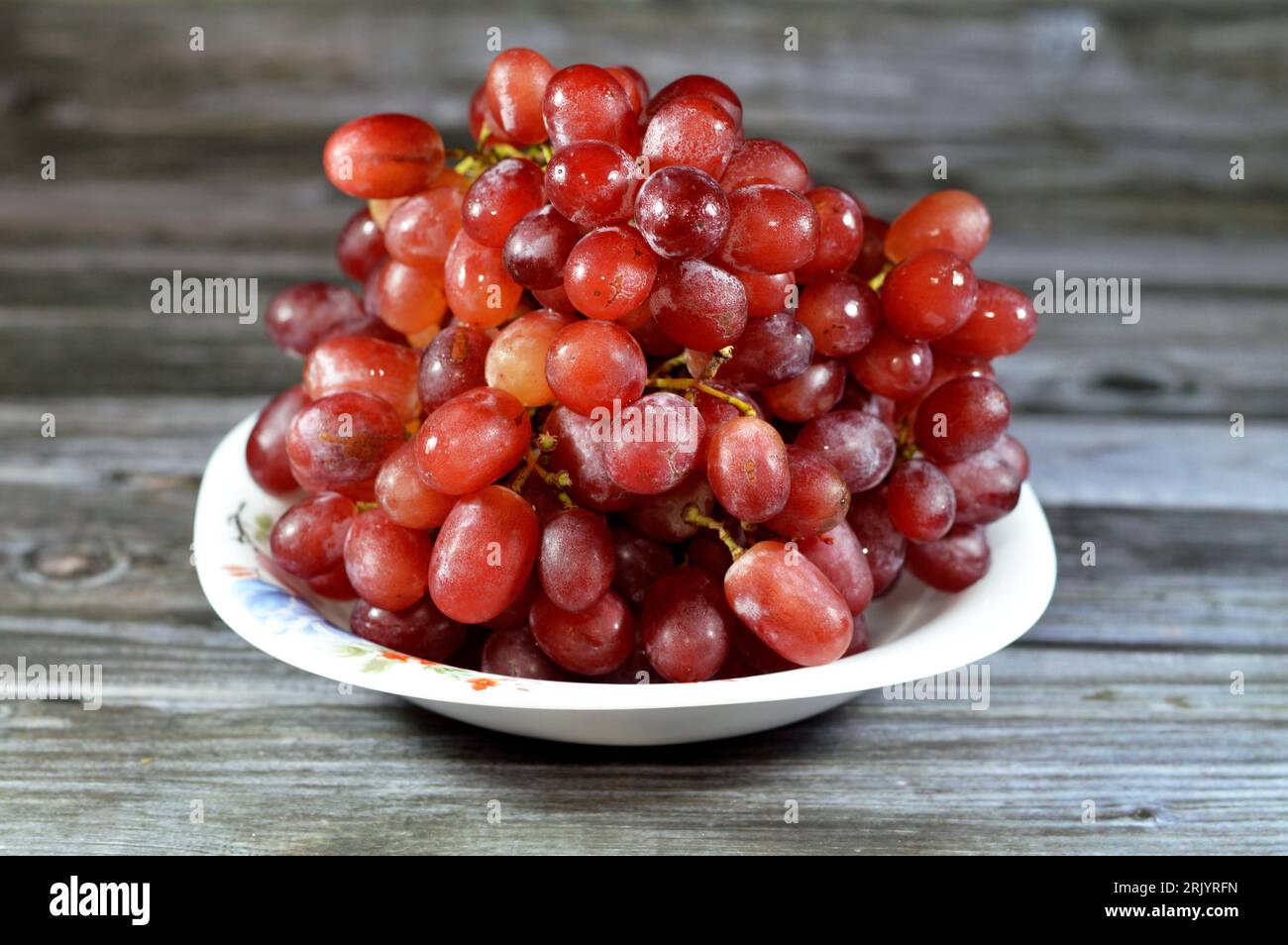 Red grapes, a fruit, botanically a berry of the deciduous woody vines ...