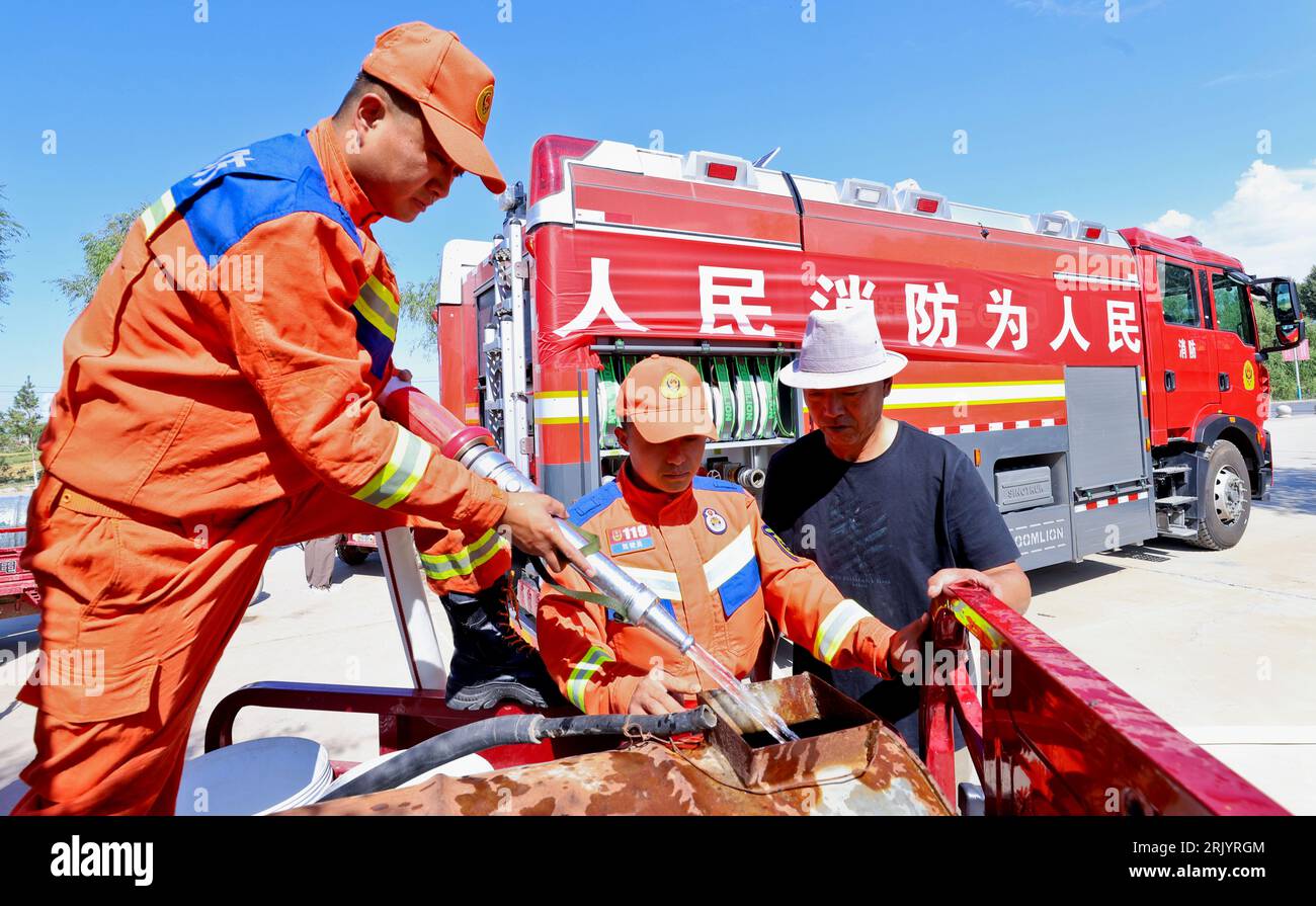 ZHANGYE, CHINA - AUGUST 23, 2023 - Drought relief workers inject water ...