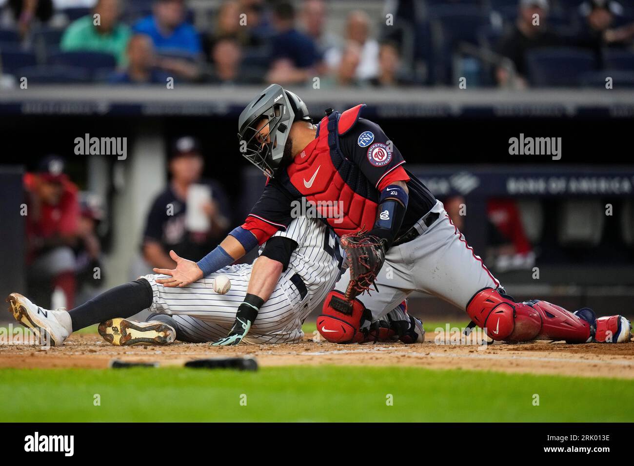 Washington Nationals catcher Keibert Ruiz drops the ball as New York ...