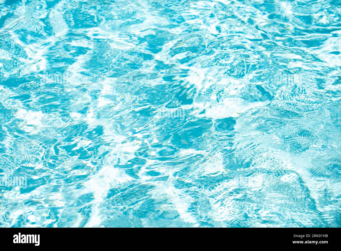 Ripple Water in swimming pool with sun reflection. Wavy water ...