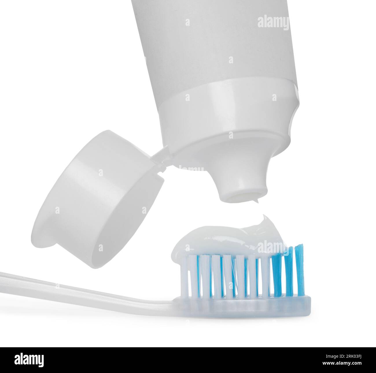 Applying paste on toothbrush against white background, closeup Stock ...