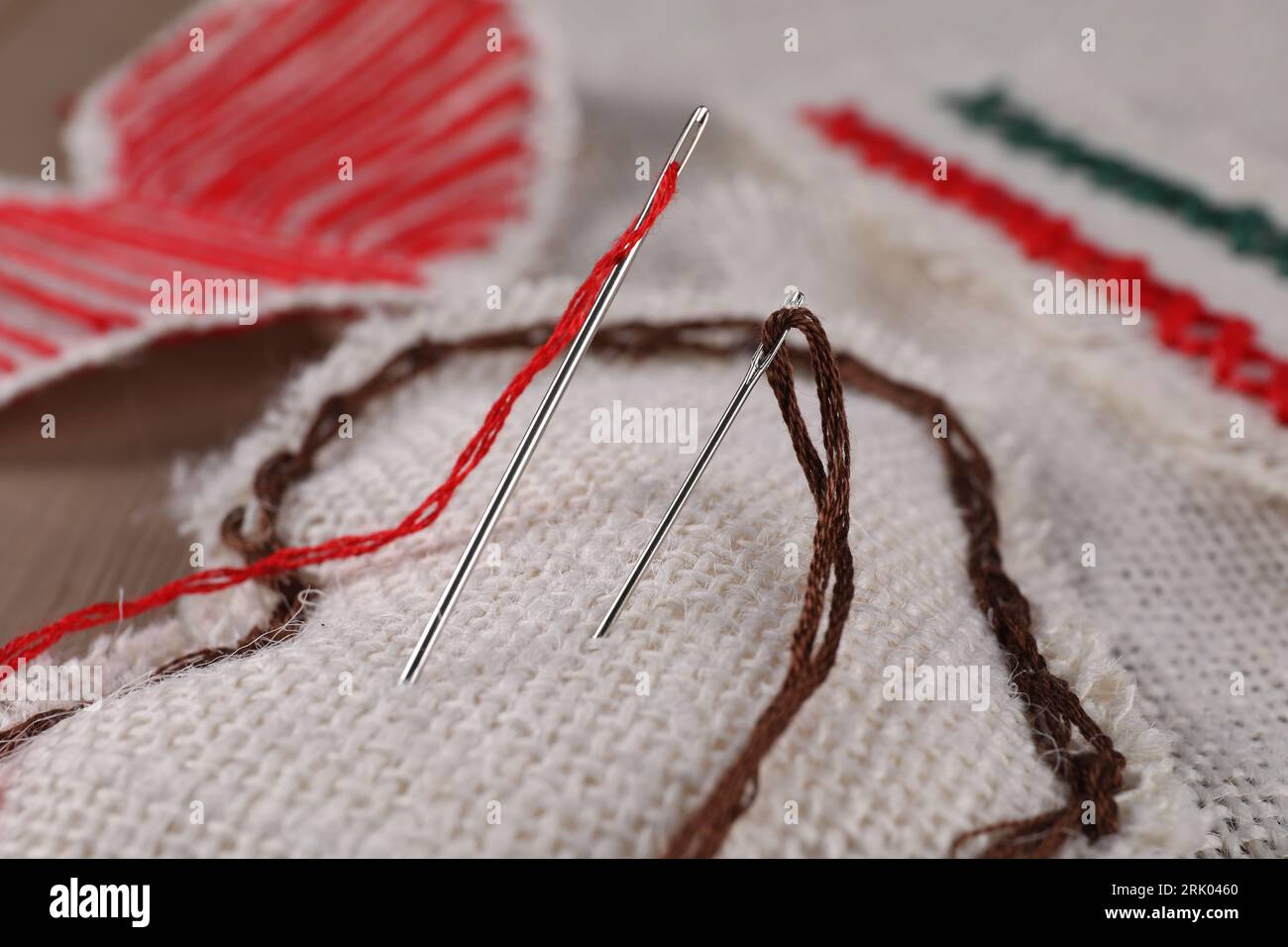 Heart made of burlap fabric, threads and needles, closeup Stock Photo ...