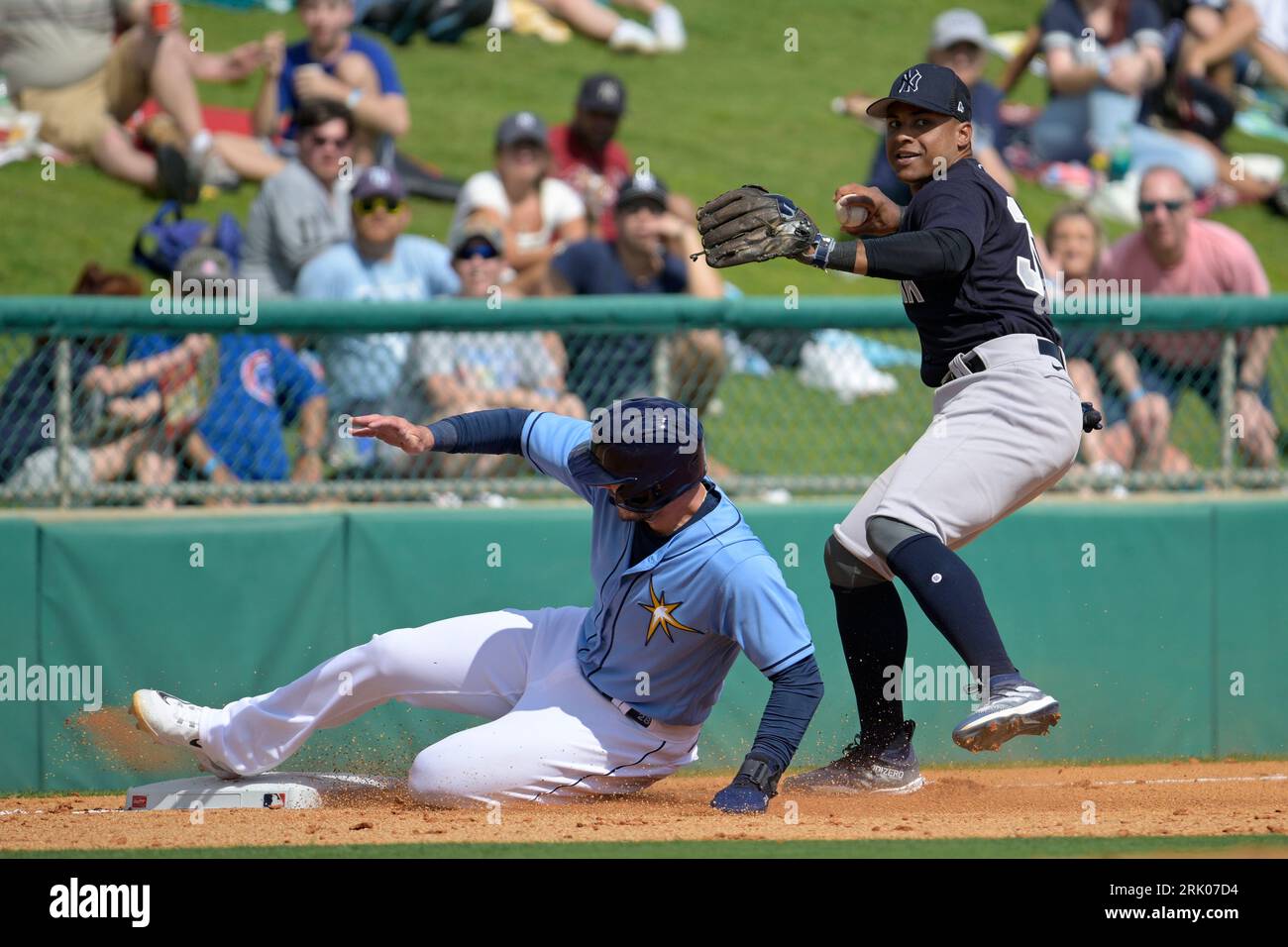New York Yankees third baseman Wilmer Difo, right, throws to first base ...