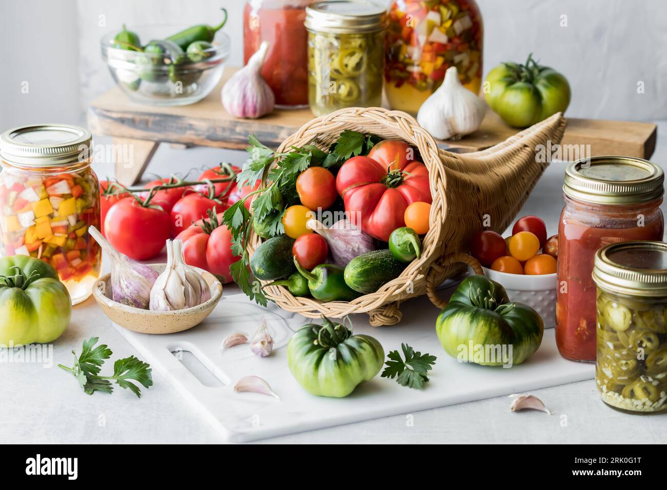 A cornucopia filled with vegetables with vegetable preserves and ...