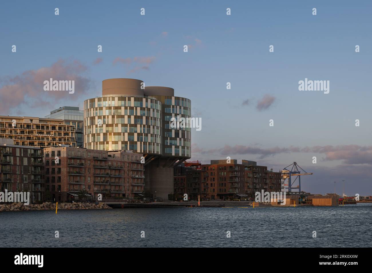 Outdoor twilight view at waterfront of Nordhavn Bassin with residential ...