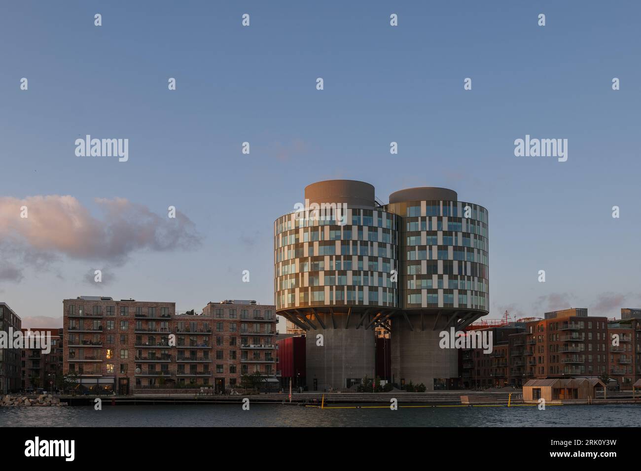 Outdoor twilight view at waterfront of Nordhavn Bassin with residential ...