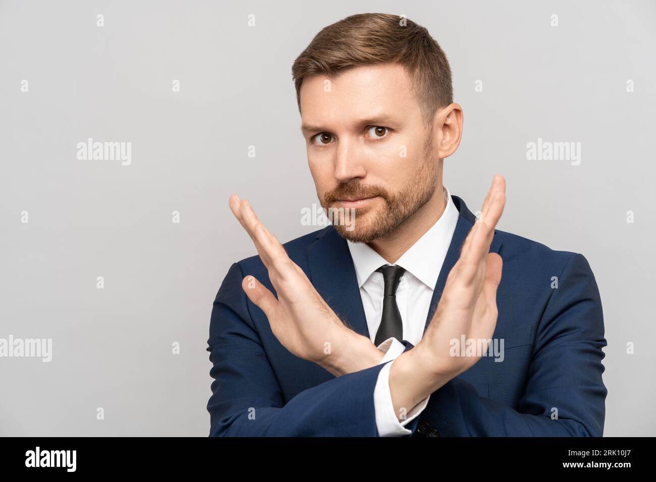 Disagreeing man disapprove with palms gesture sign rejection on studio ...