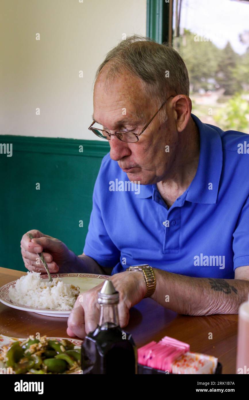 Man eating rice hi-res stock photography and images - Alamy