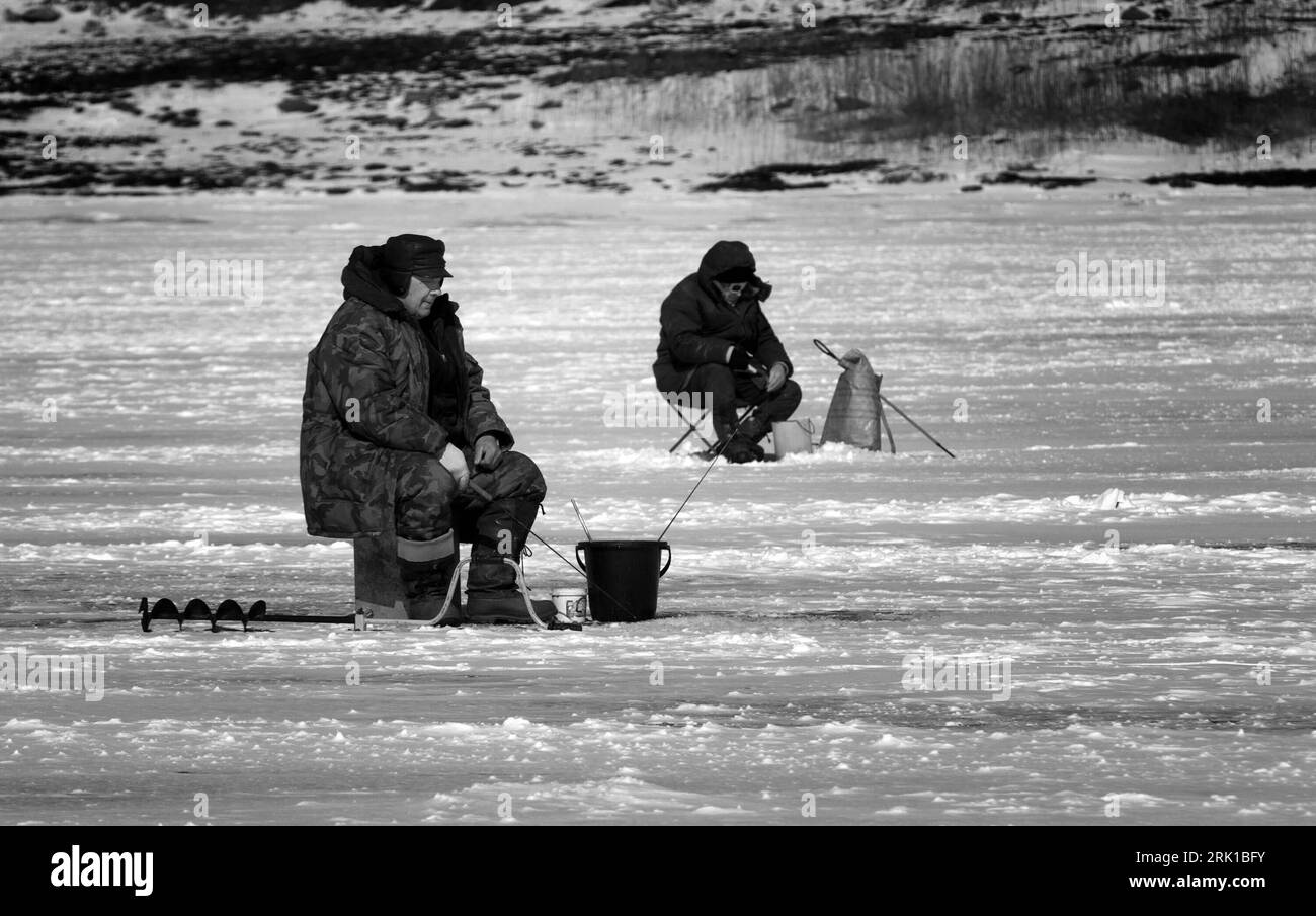 Ice fishing russia Black and White Stock Photos & Images - Alamy