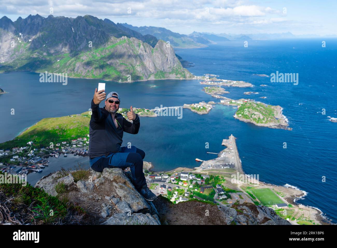 Man travel blogger taking photo by smartphone hiking in Norway, Lofoten ...