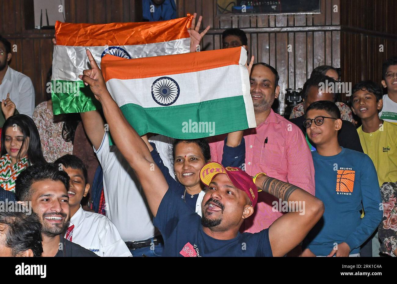 Mumbai, India. 23rd Aug, 2023. People holding Indian flags celebrate ...
