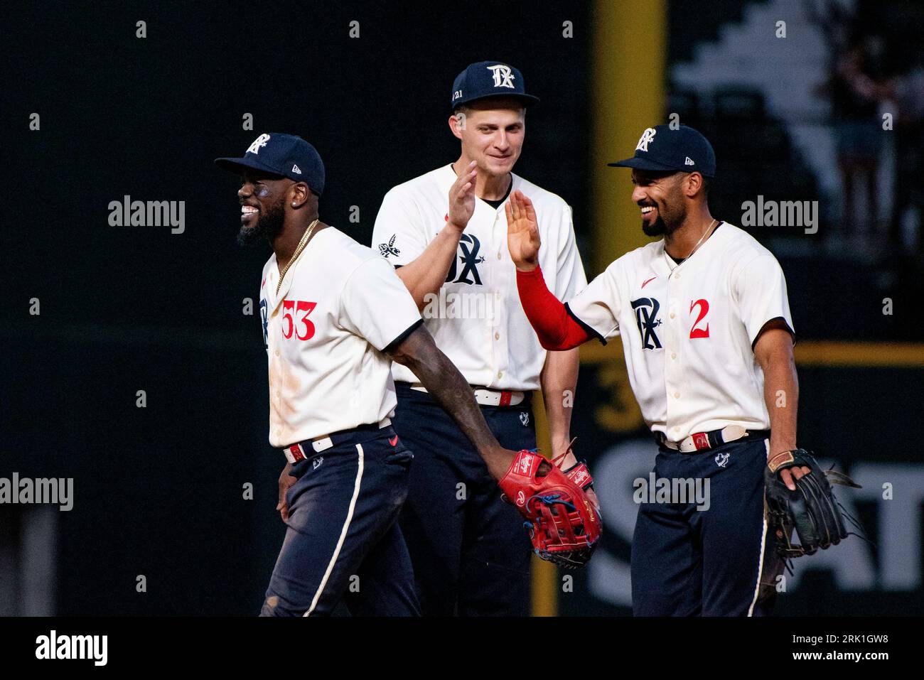 Texas Rangers right fielder Adolis Garcia (53), left, smiles with ...