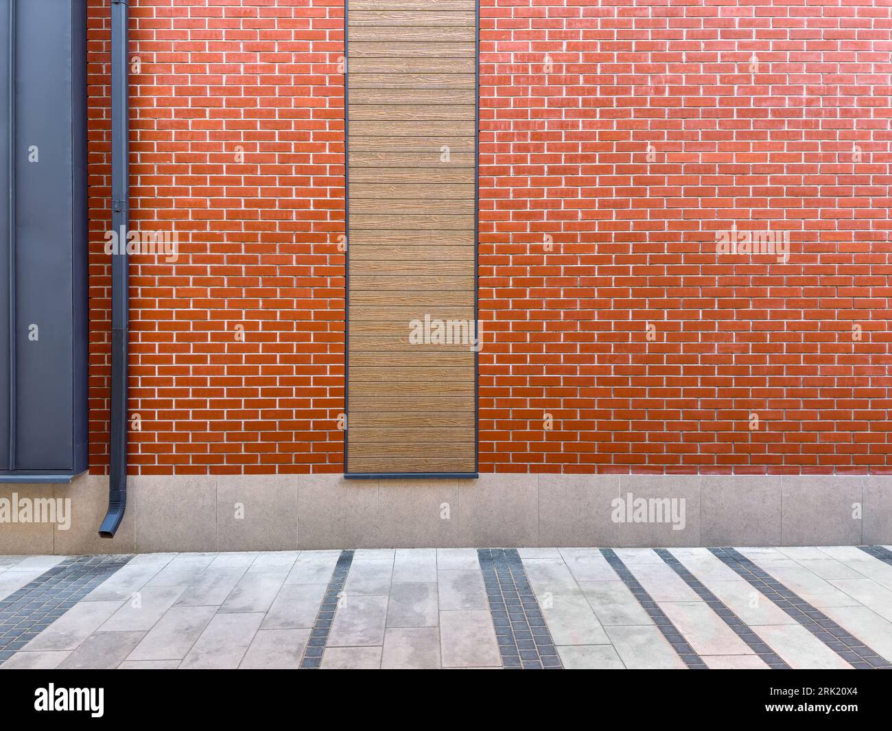 bright red brick wall of renovated building with modern architectural ...