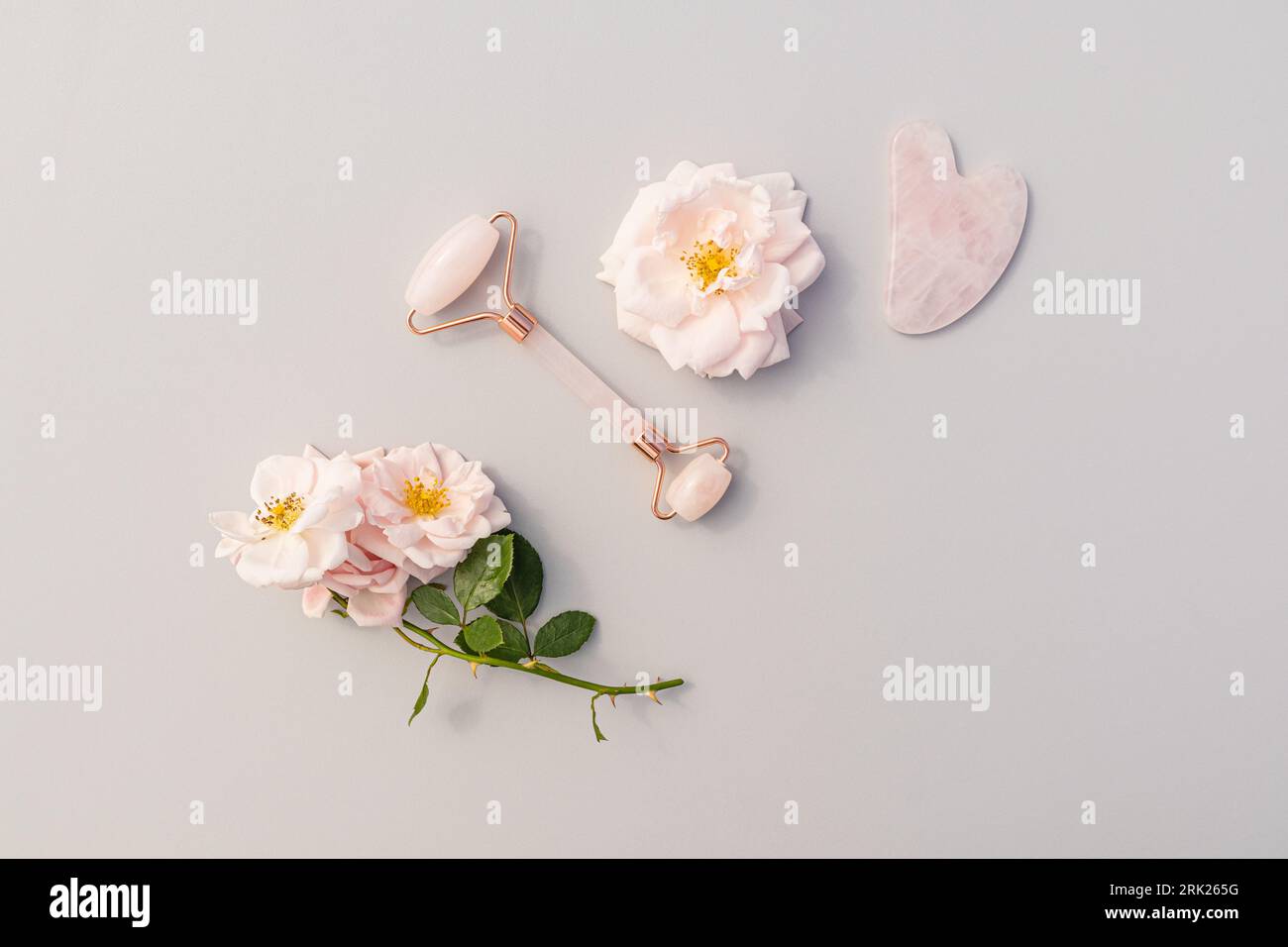 Roller massager made of rose quartz for delicate massage and skin care ...