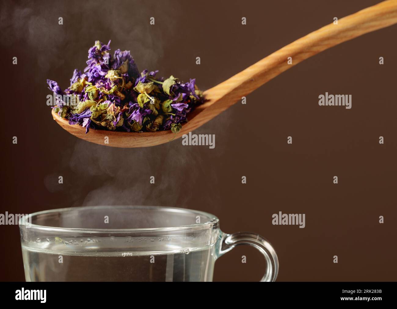Dried mallow flowers for making herbal tea and mug with hot water Stock ...