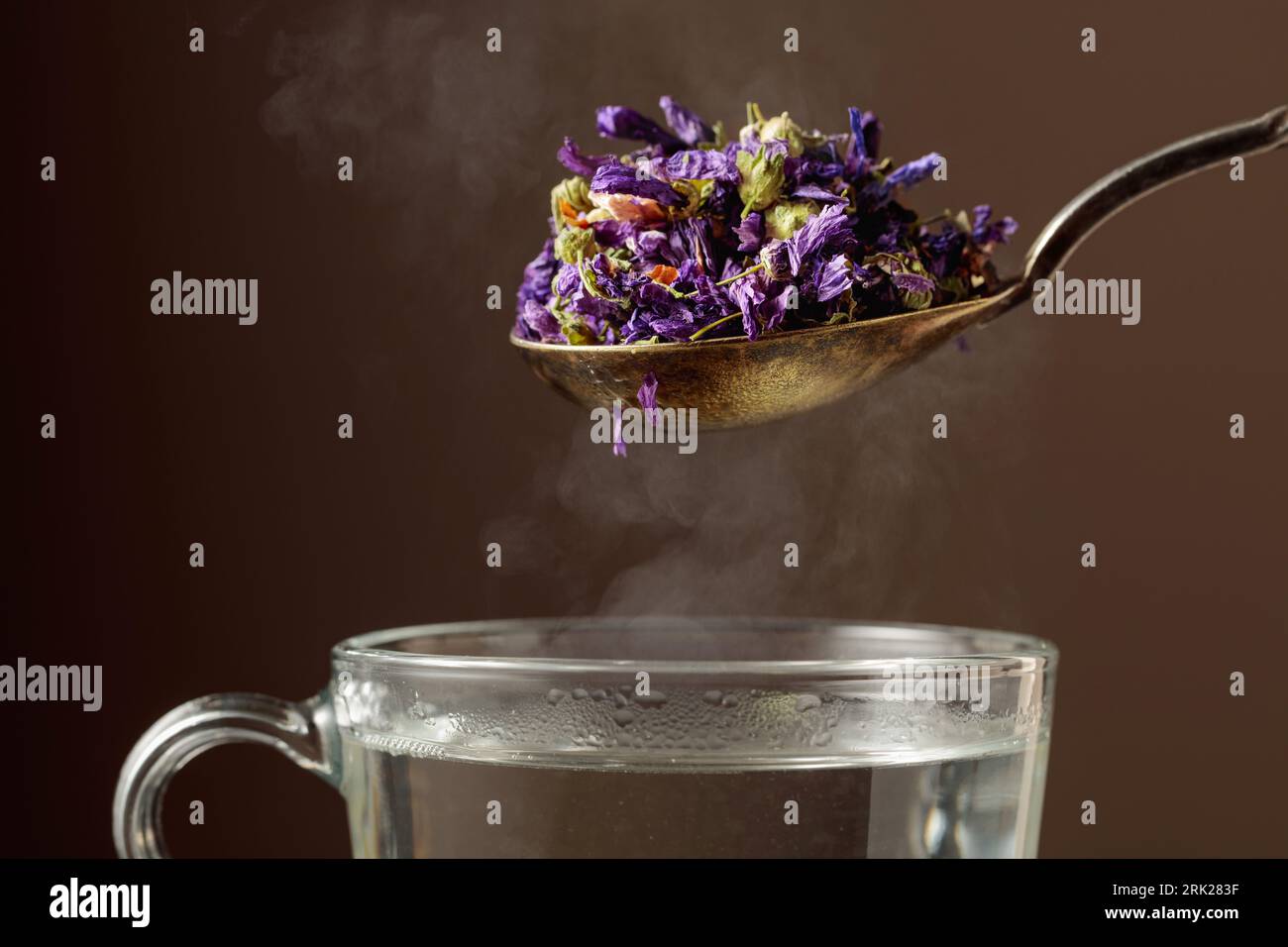 Dried mallow flowers for making herbal tea and mug with hot water Stock ...