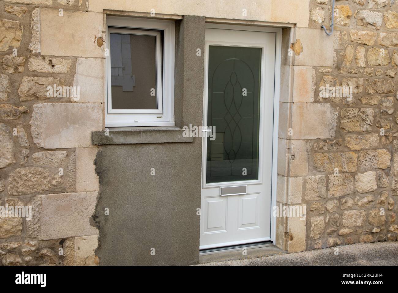 modification of the street facade with new door and window Stock Photo ...