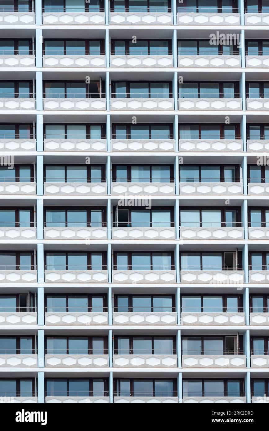 Front view of a hotel with balconies and many floors. Background full ...