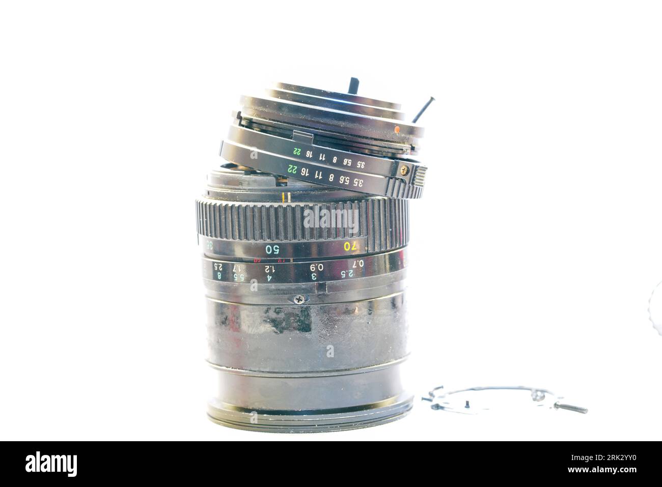 Clean and disassemble the lens for photography into its component parts ...