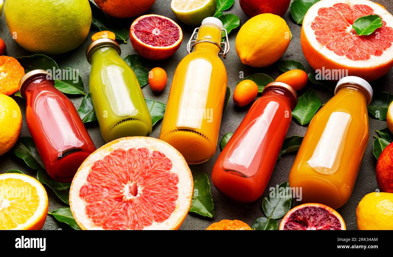 Summer fruit drinks. Citrus juices and smoothies in bottles, food ...