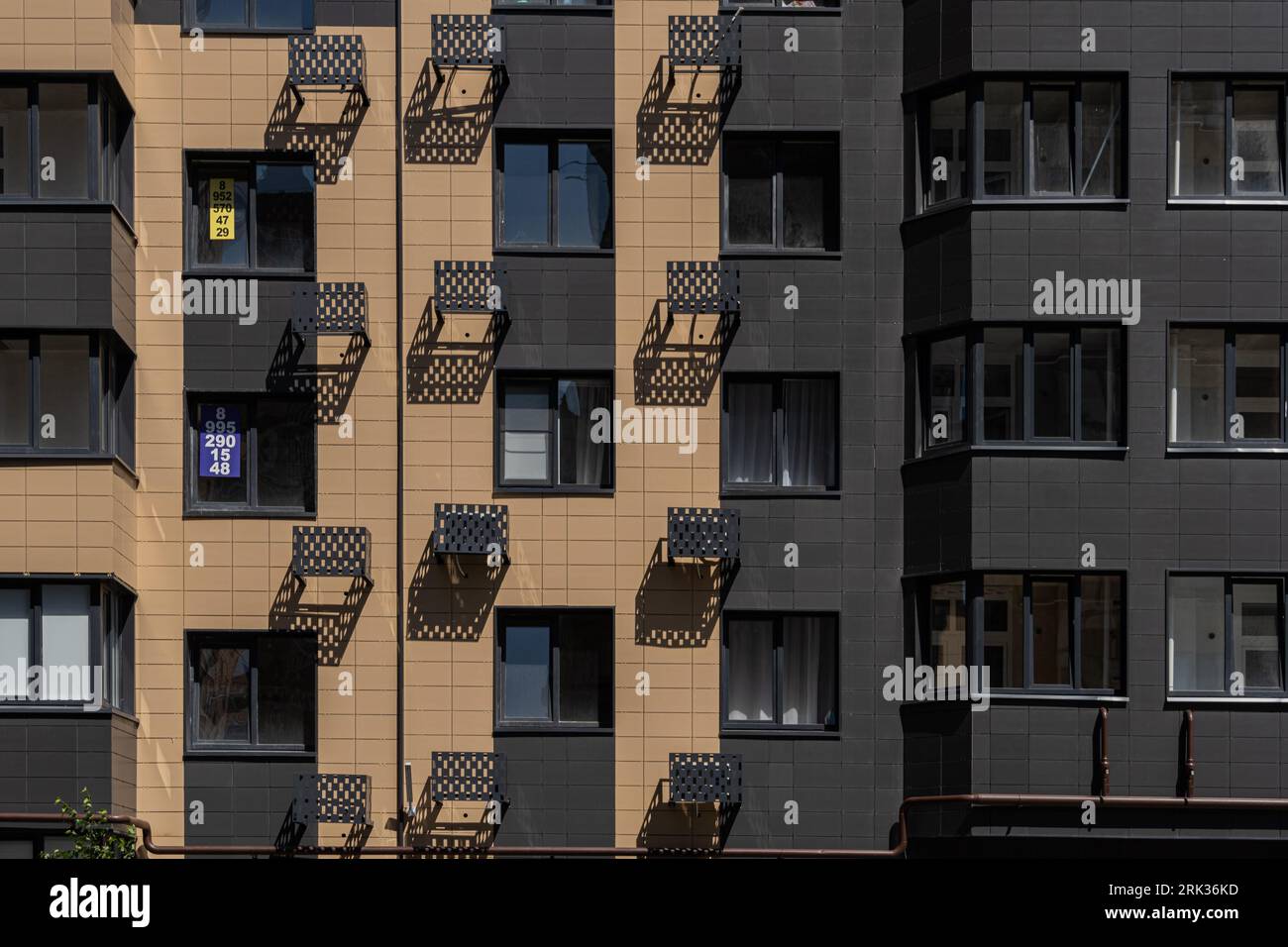 New building facade in housing complex. Modern style in architecture ...