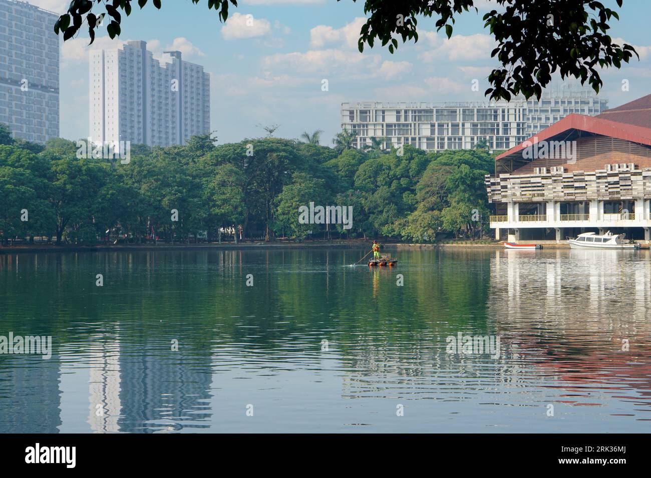 tall building reflection on lake Stock Photo - Alamy