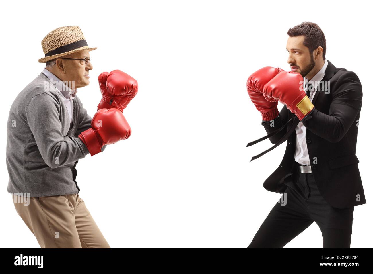 Elderly gentleman and a businessman practicing boxing isolated on white ...