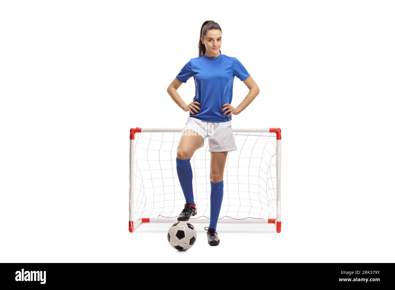 Full length portrait of a female football player posing in front of a ...