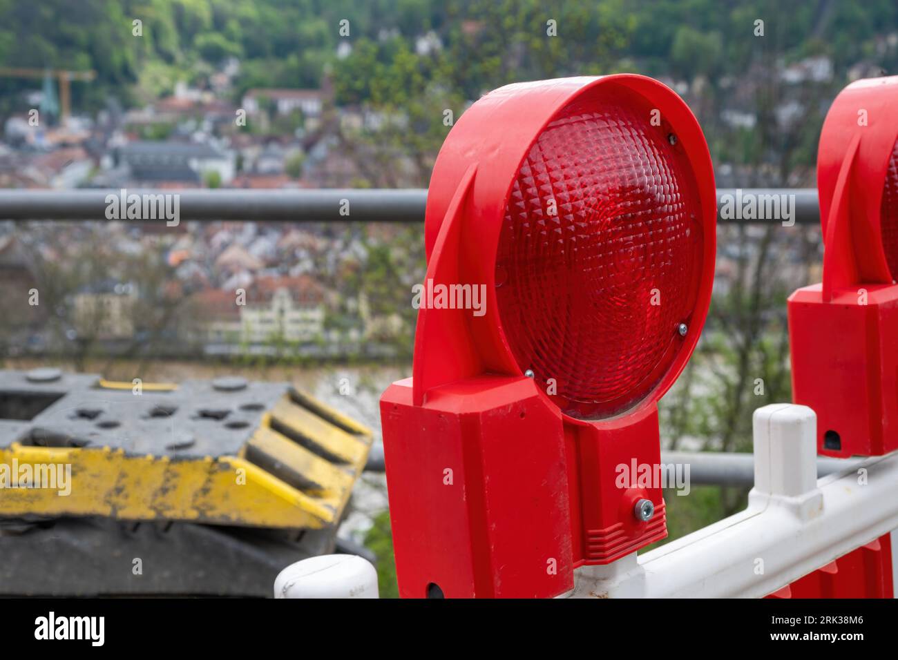 Construction safety. Street barricade with warning signal lamps on a ...