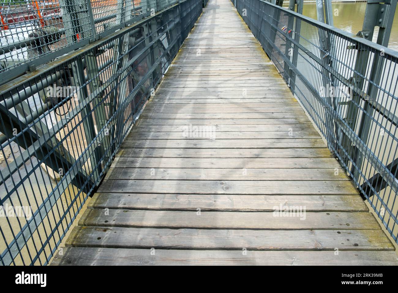 Bridge with metal railing over Neckar River, Heidelberg city, Germany ...