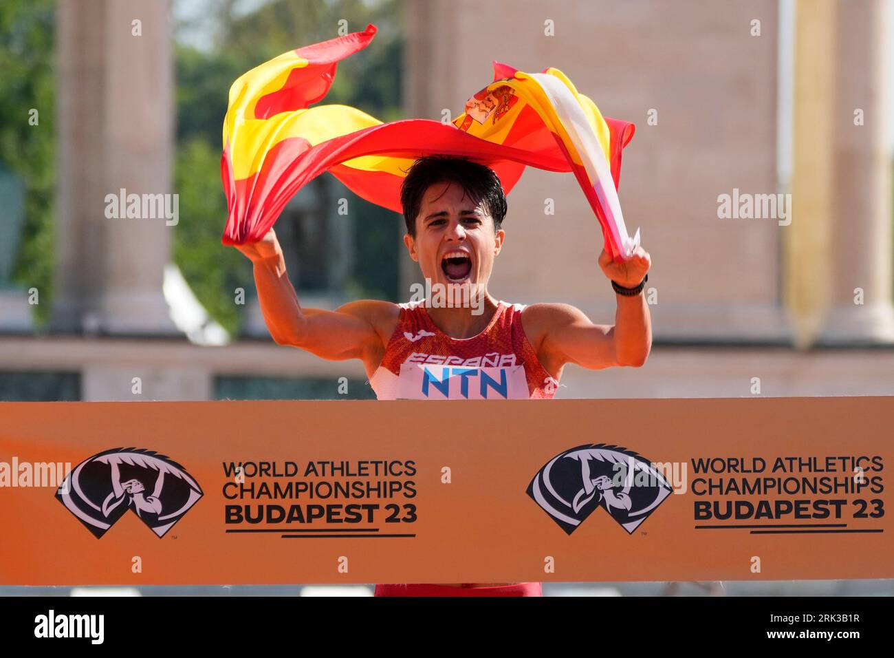 María Perez, of Spain, celebrates as she crosses the finish line to win ...
