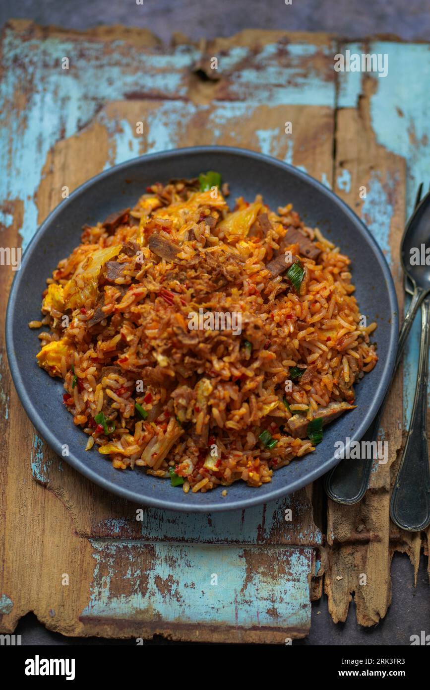 Nasi goreng rendang, Indonesian fried rice with beef rendang Stock ...