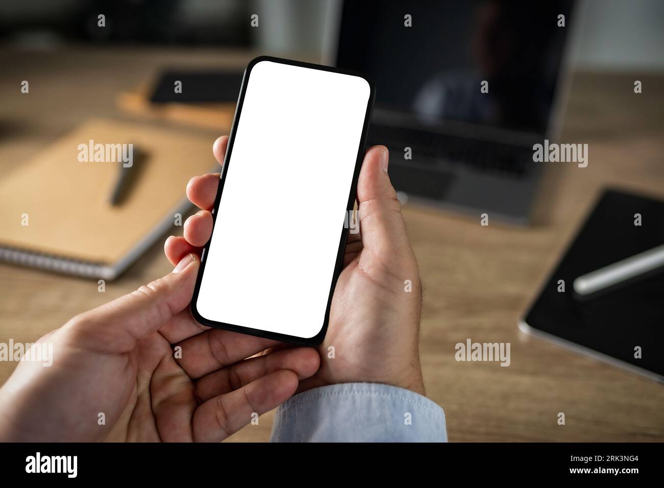 Man hand using phone with blank screen and modern frameless design and ...