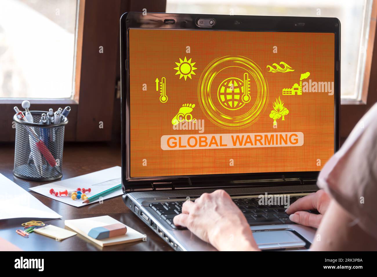 Laptop screen displaying a global warming concept Stock Photo - Alamy