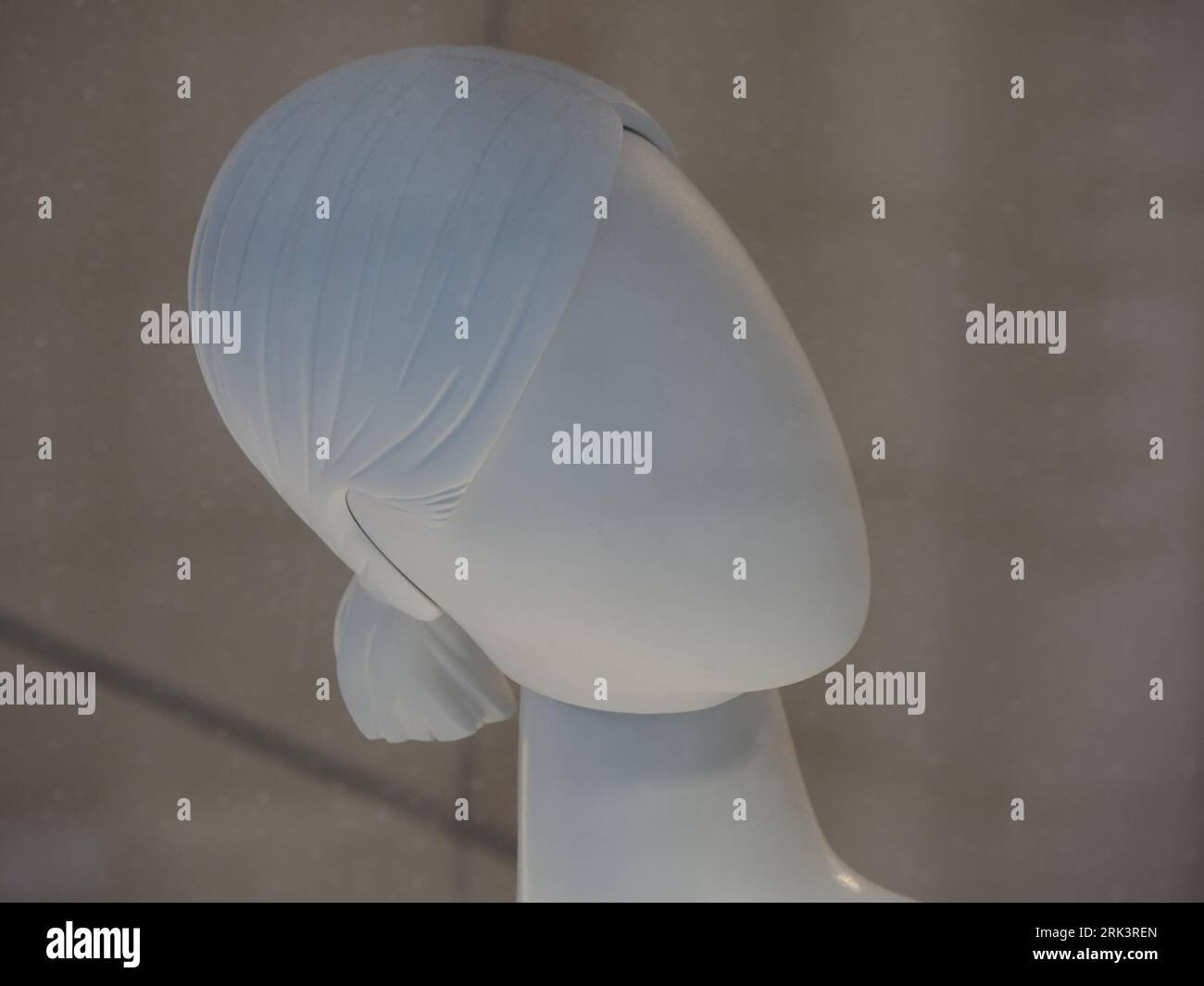 A Female mannequin in shop window. woman Head dummy shows fashionable ...