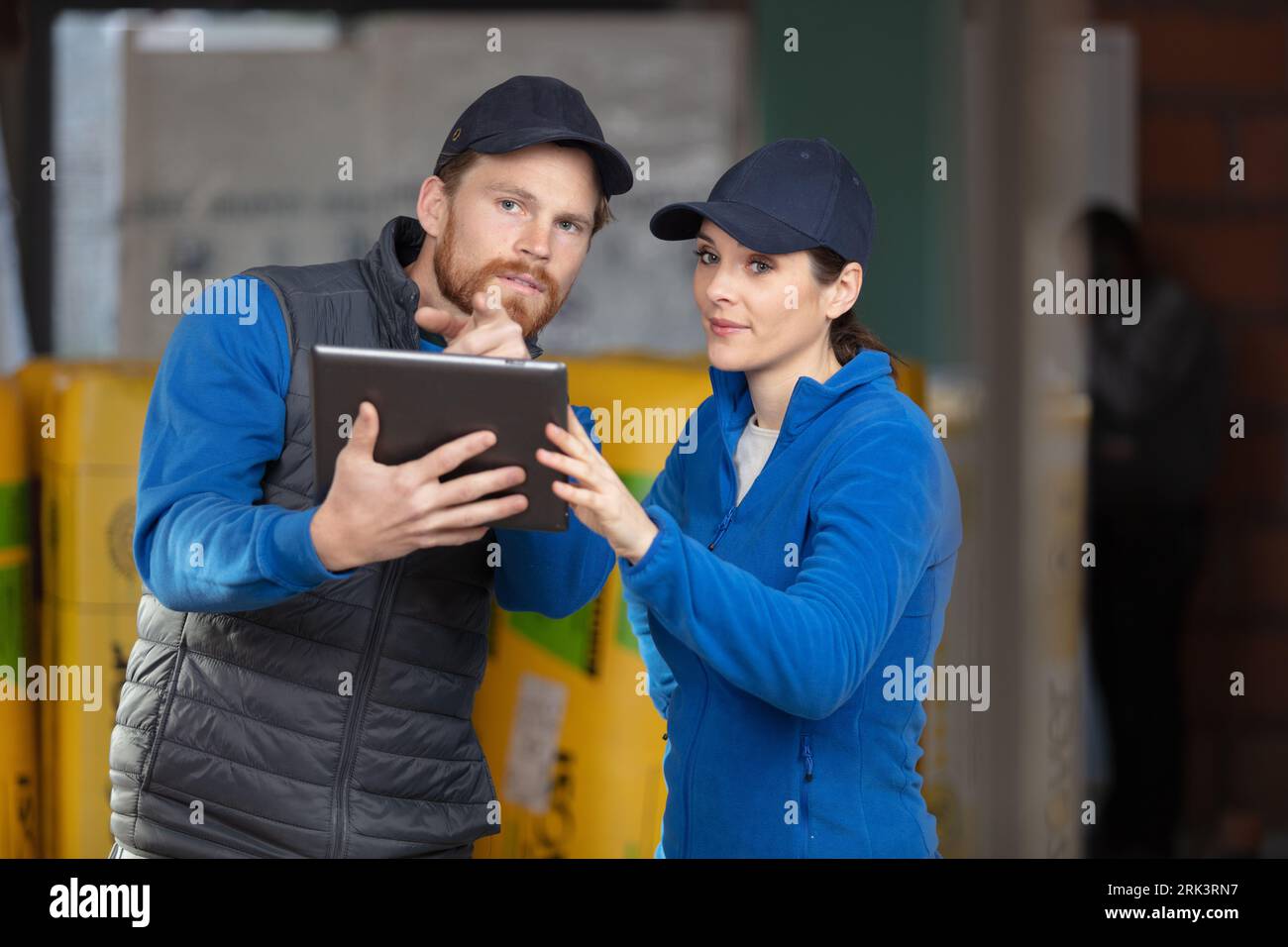 builders with tablet at construction Stock Photo - Alamy