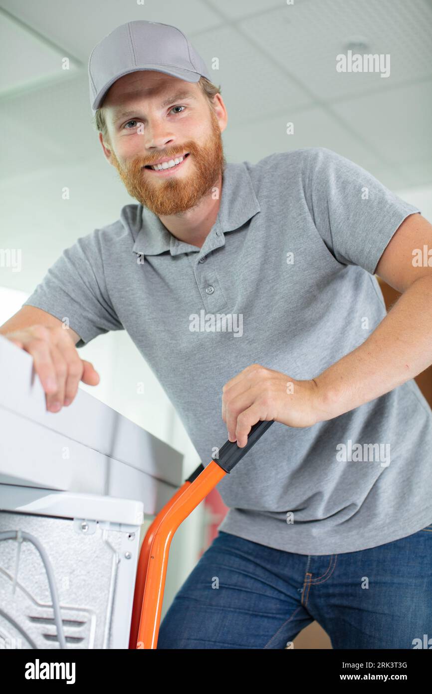 Moving a washing machine hi-res stock photography and images - Alamy