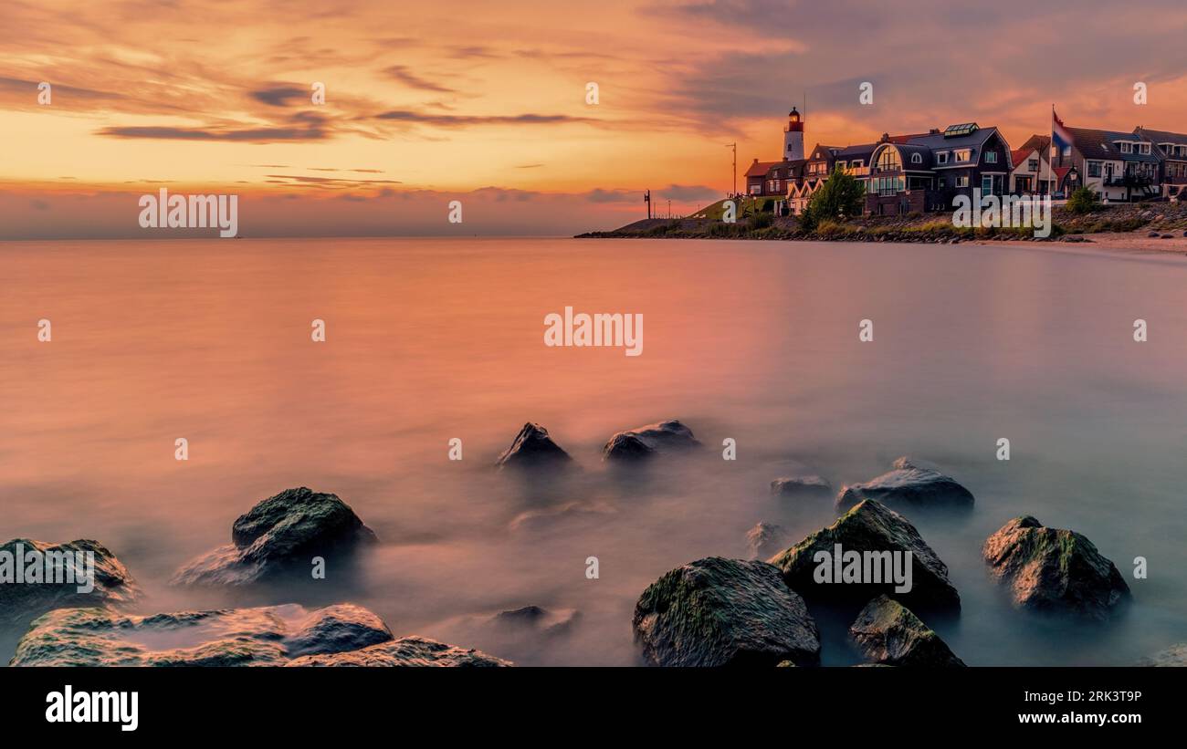 Urk Flevoland Netherlands sunset at the lighthouse and harbor of Urk ...