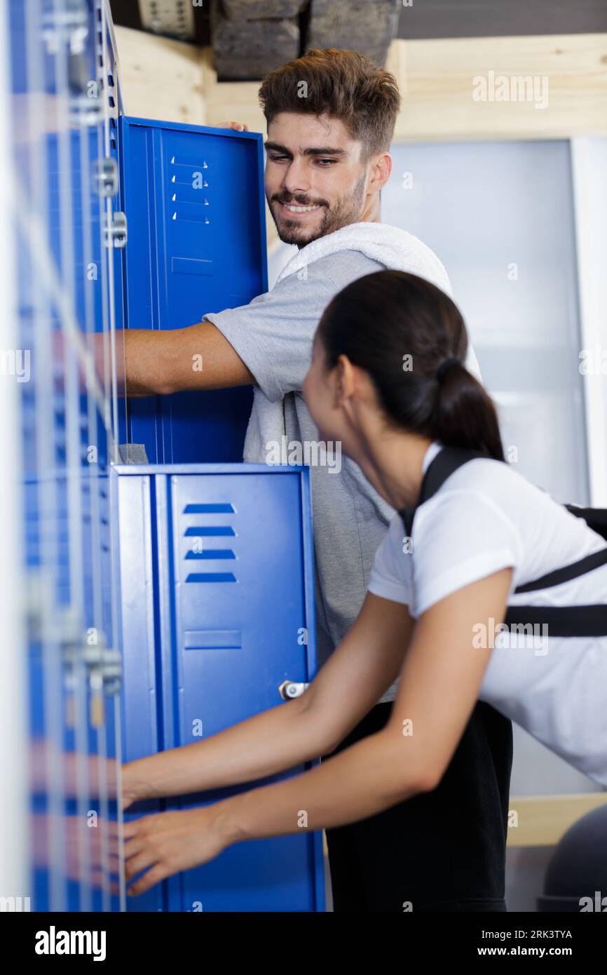 young couple talking in gyms locker room Stock Photo - Alamy