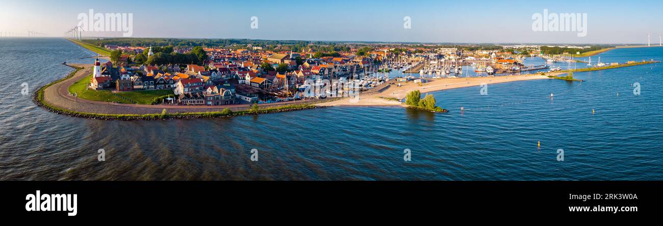 Urk Flevoland Netherlands sunset at the lighthouse and harbor of Urk ...
