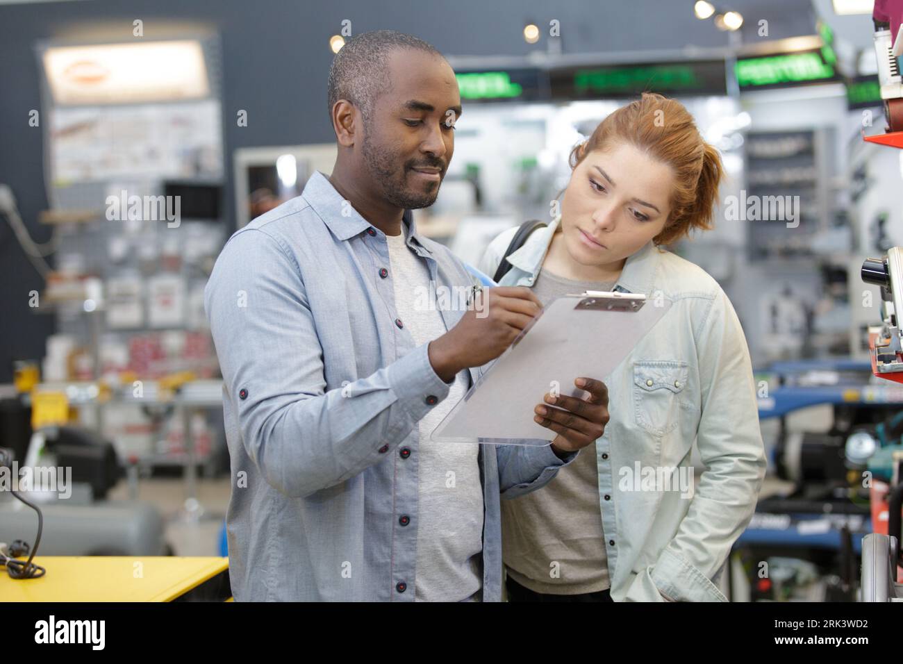 taking notes in bricolage store Stock Photo - Alamy