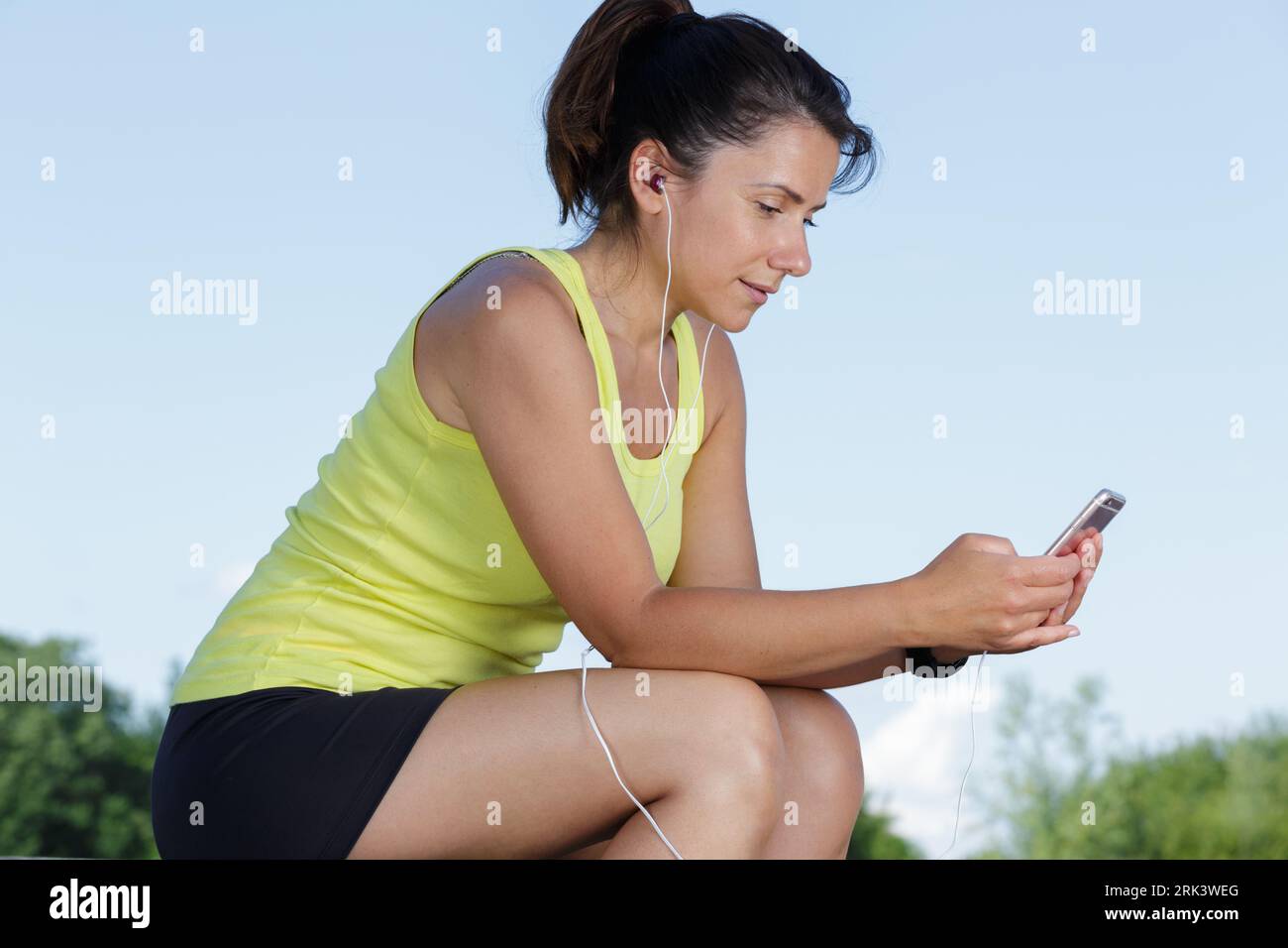 beautiful smiling sportswoman taking a break after workout Stock Photo ...