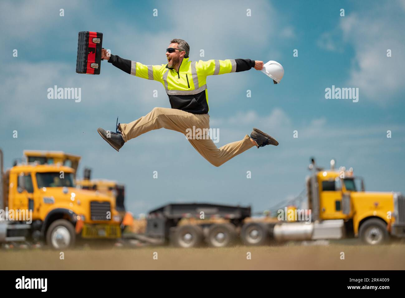 Hispanic 40 s builder excited jump on site construction. Excited ...