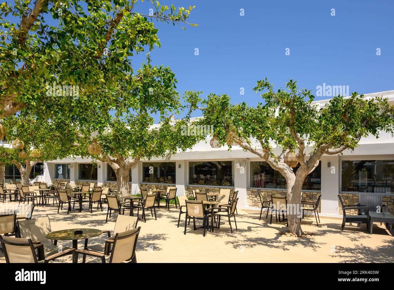 Kos, Greece - May 7, 2023: Cozy Greek hotel cafe terrace with tables ...