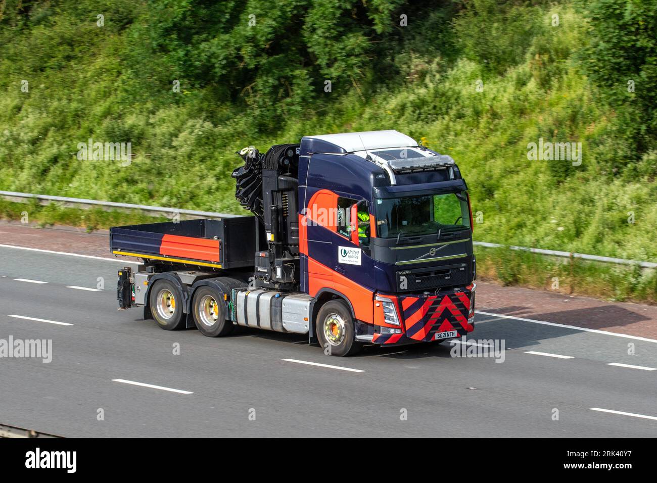 United Utilities 2021 Red Black Volvo FH truck. A dropside Crane ...