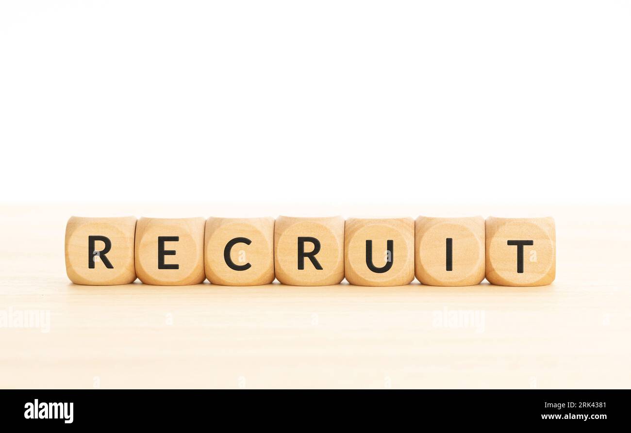 Recruit word on wooden blocks on white background. Copy space Stock ...