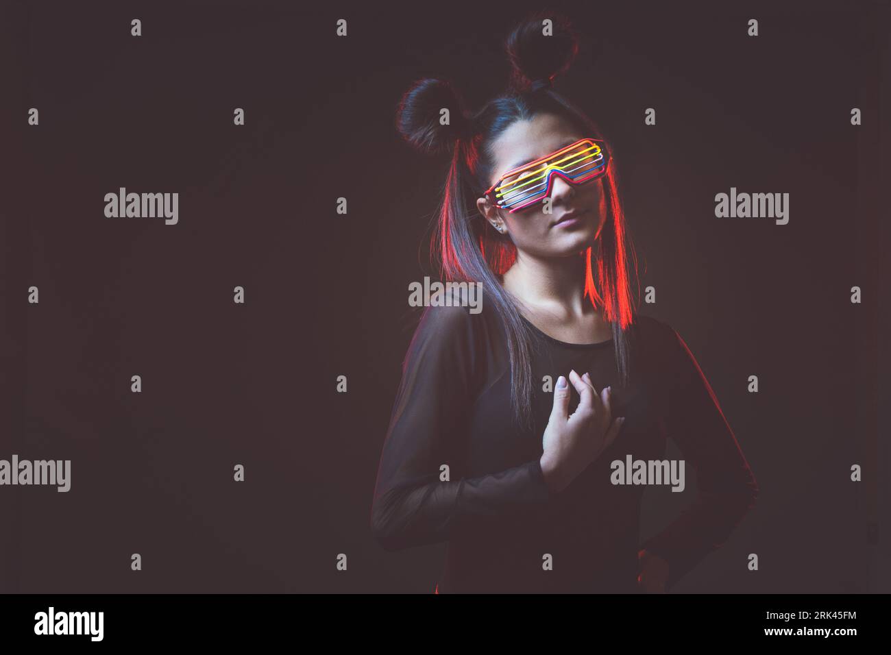 Portrait of beautiful cyber model woman posing wearing led glasses on ...