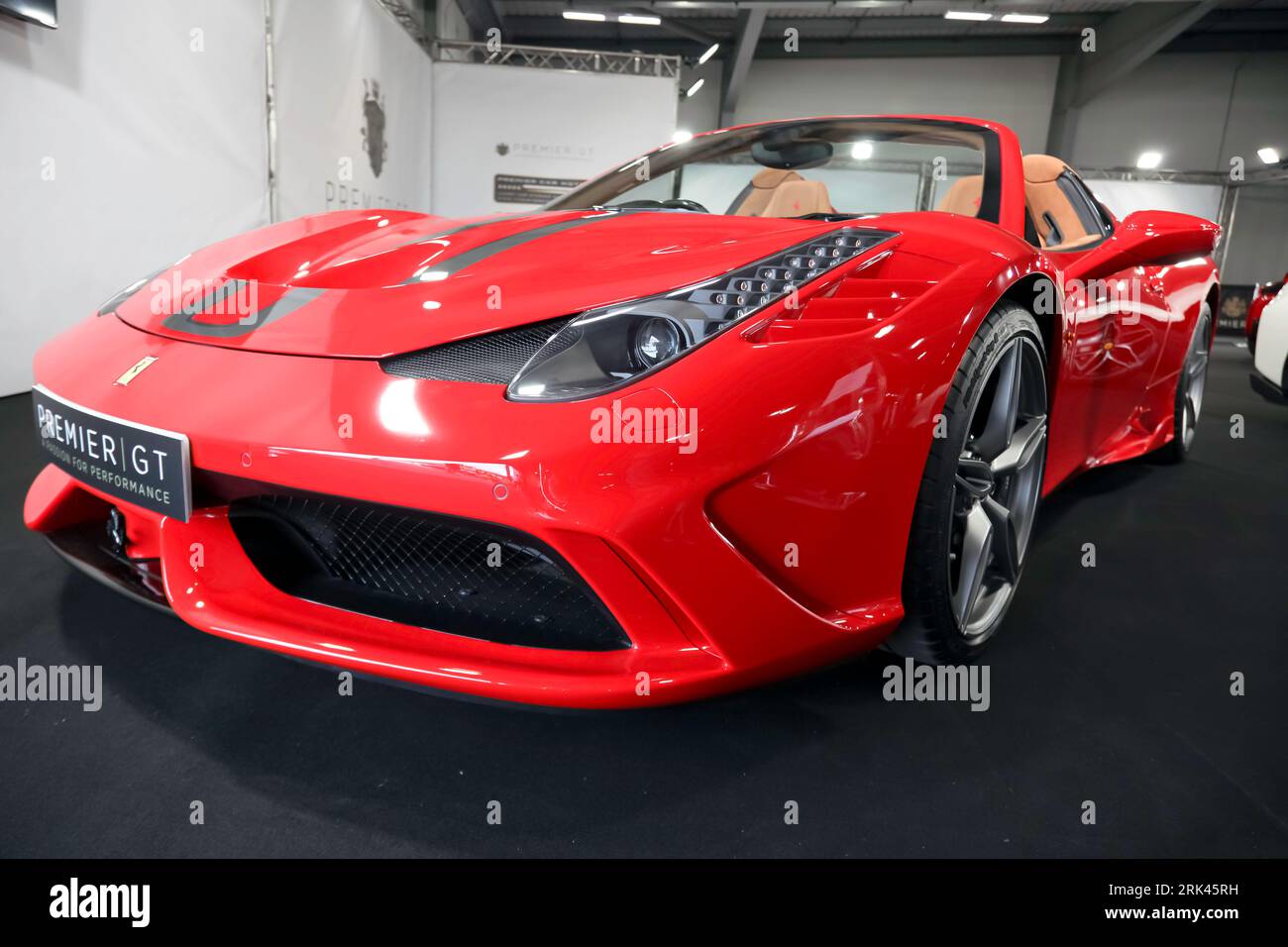 Three-quarters front view of a Red, 2016, Ferrari 458 Speciale Aperta on the Premier GT Stand ...